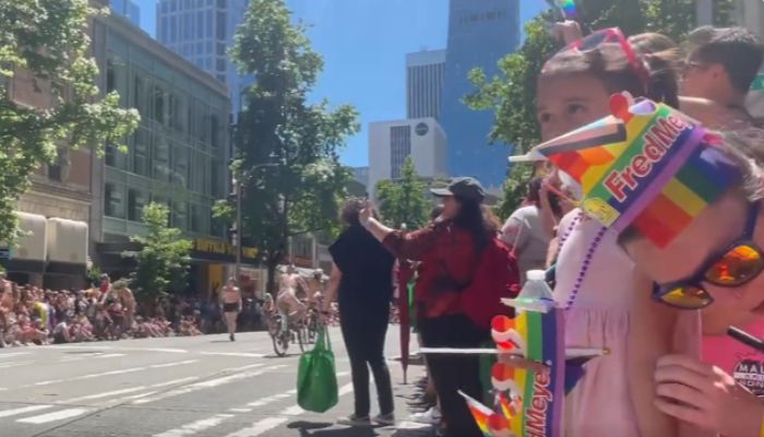 Cyclists drive naked in Seattle Pride Parade in the presence of children